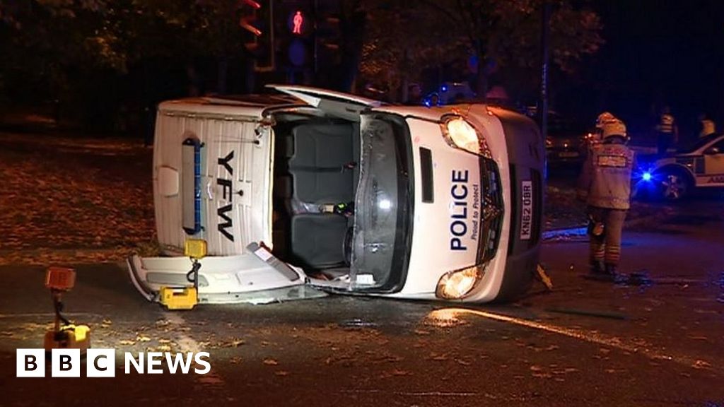 Four hurt as police van collides with taxi - BBC News