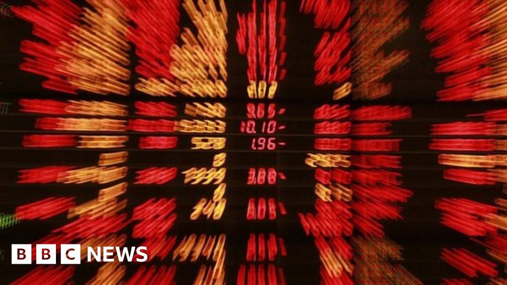 32 charged over 'insider trading hack' scheme - BBC News