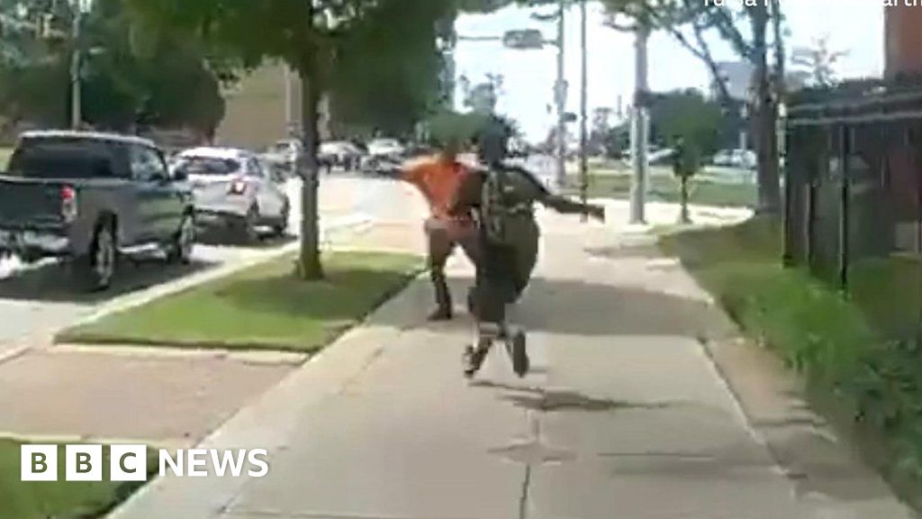 Bodycam captures moment citizen tackles suspect - BBC News
