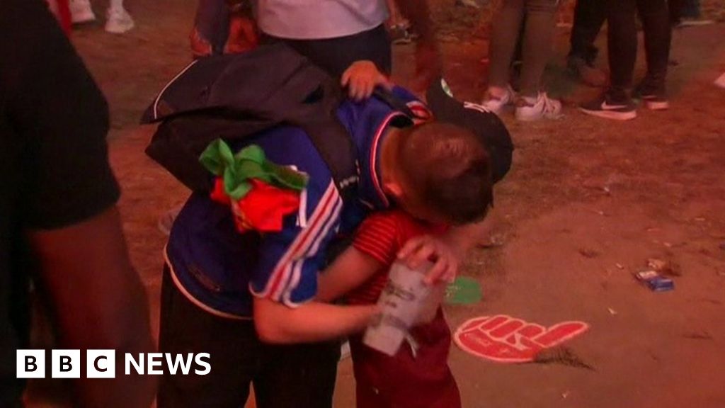 Portuguese boy hugs crying French fan - BBC News