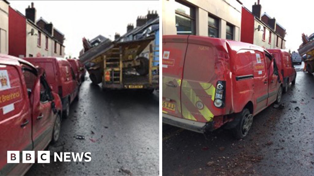 Royal Mail vans damaged by falling digger in Narberth - BBC News