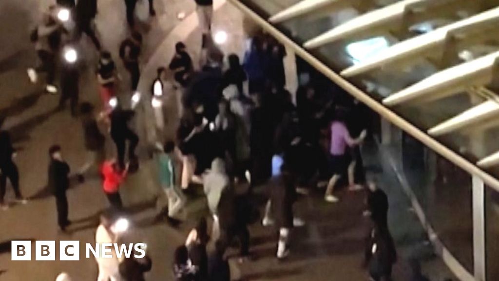 Watch: Protesters attack Nike store in central Paris - BBC News
