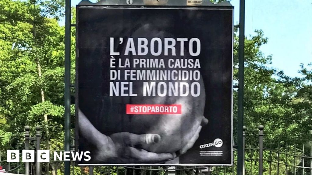 Italy anti-abortion posters spark outcry in Rome - BBC News
