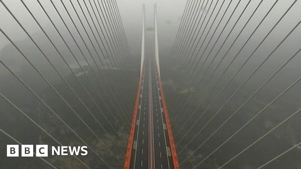 World's highest bridge opens to traffic in China - BBC News
