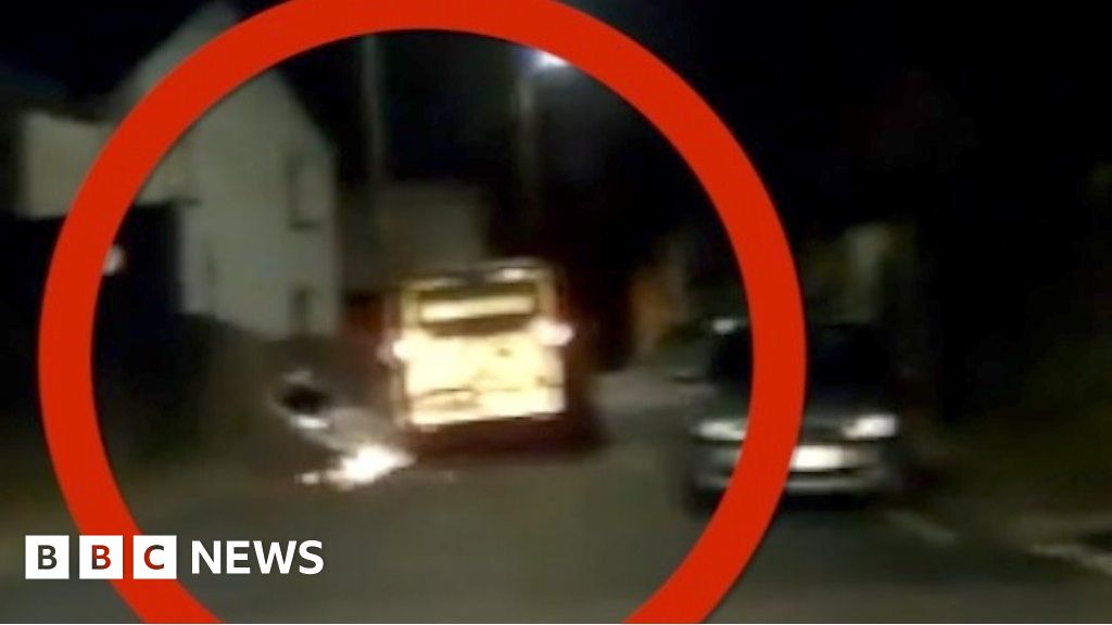 Sparks fly as police van door flies off - BBC News