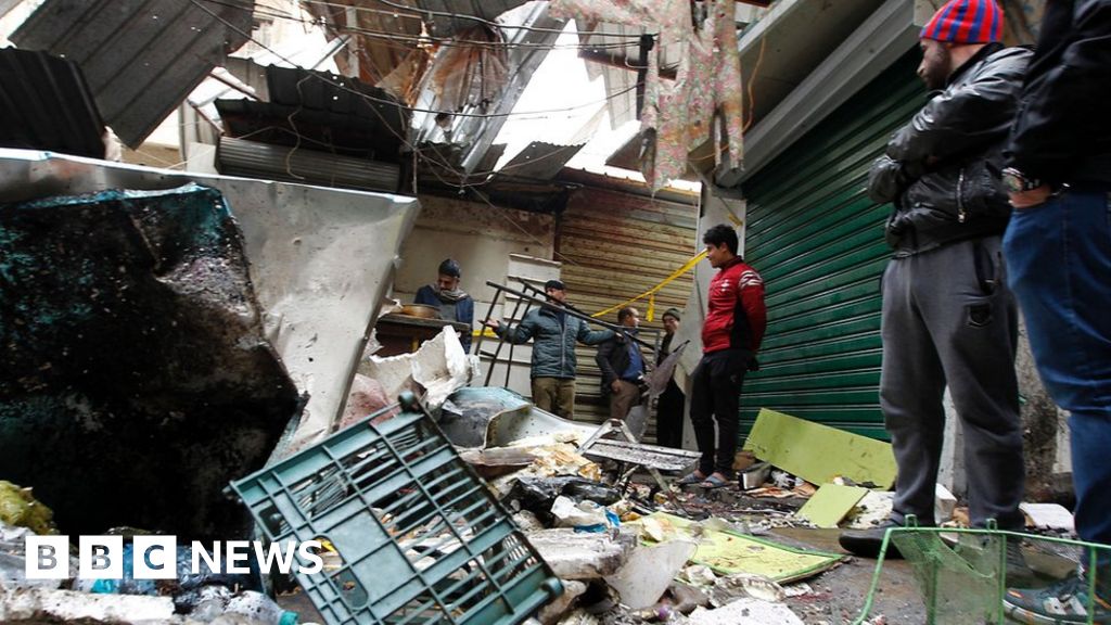 Iraq Baghdad: 28 dead as twin bombs rip through market - BBC News