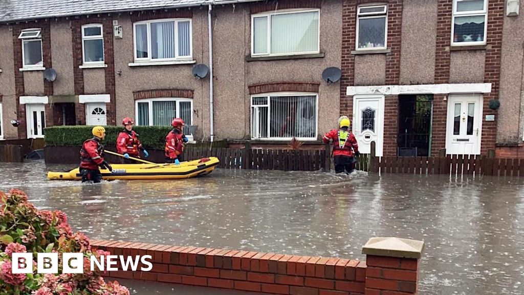 Flooding victims forced out of homes return after eight months - BBC News