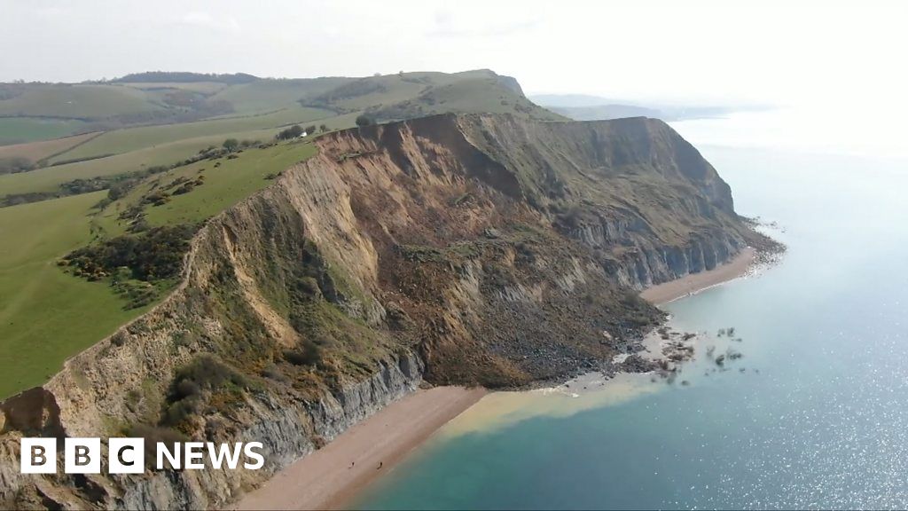 Aftermath of huge rockfall in Dorset filmed by drone - BBC News