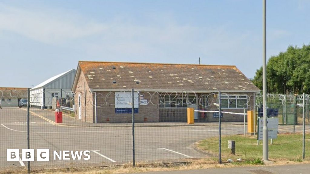 Afghans who helped UK housed in Dorset military camp - BBC News