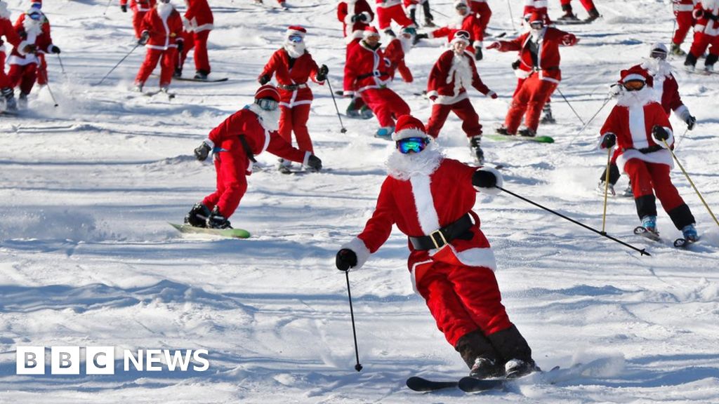 Skiing Santas take to the slopes in Maine - BBC News