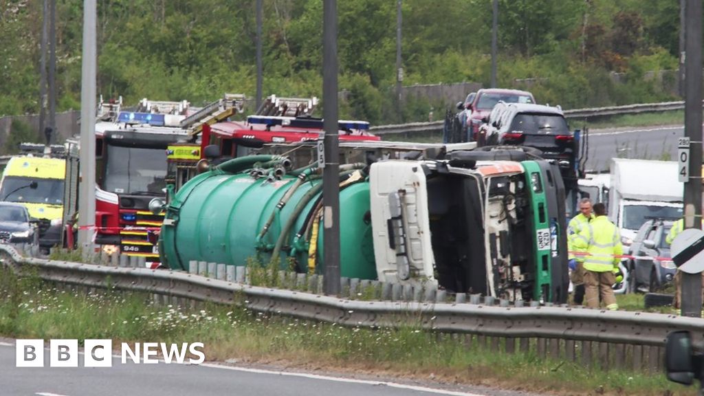 A23 closed in Bolney after sewage tanker overturns - BBC News