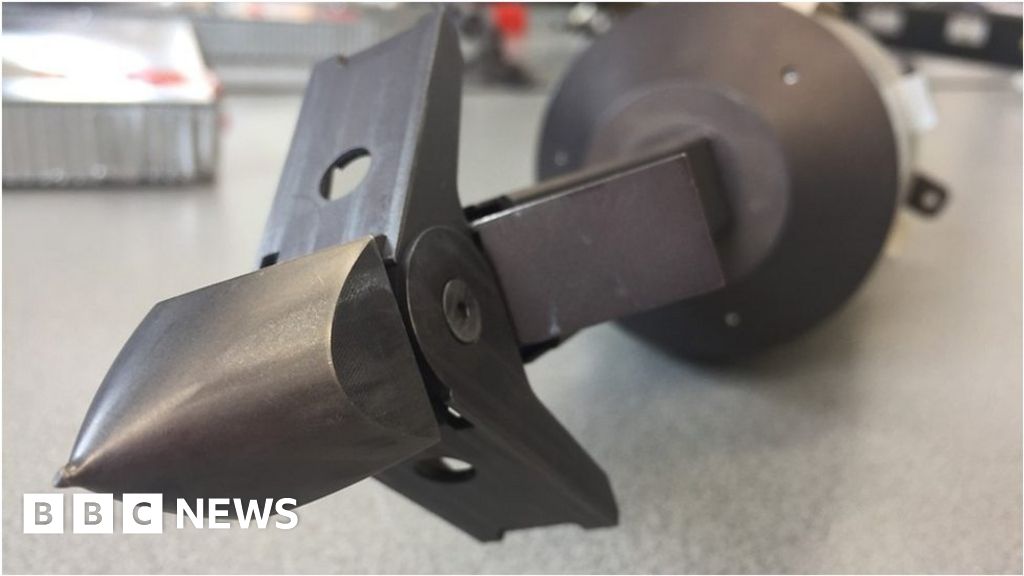 Space harpoon test for orbital junk - BBC News