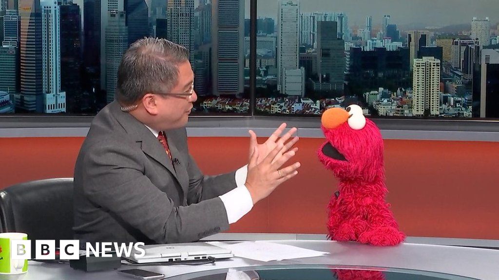BBC newsreader interviews Sesame Street's Elmo
