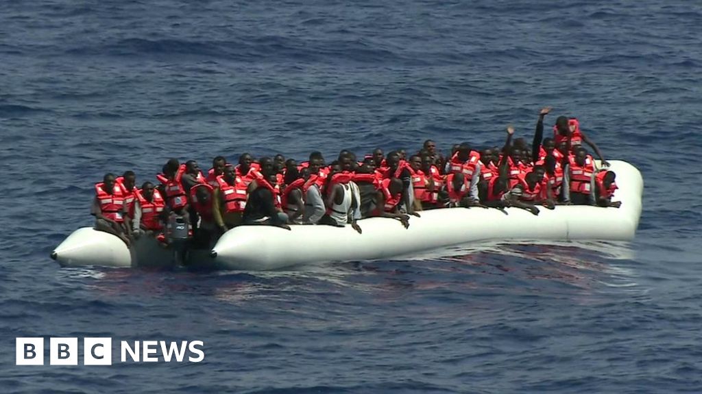 Migrant crisis: 'A huddle of humanity' pulled from open seas - BBC News