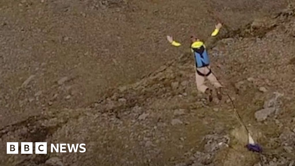Daredevil completes highest Base jump recorded in Wales - BBC News