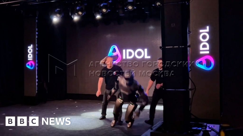 Russia's AI robot falls seconds after being unveiled - BBC News