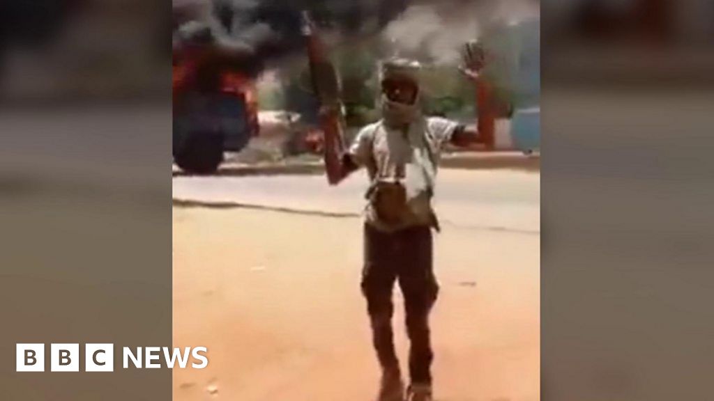 RSF soldier in front of police HQ in Sudan's West Darfur - BBC News