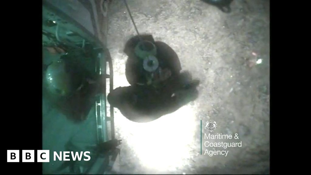 Four walkers airlifted off mountain ledge - BBC News