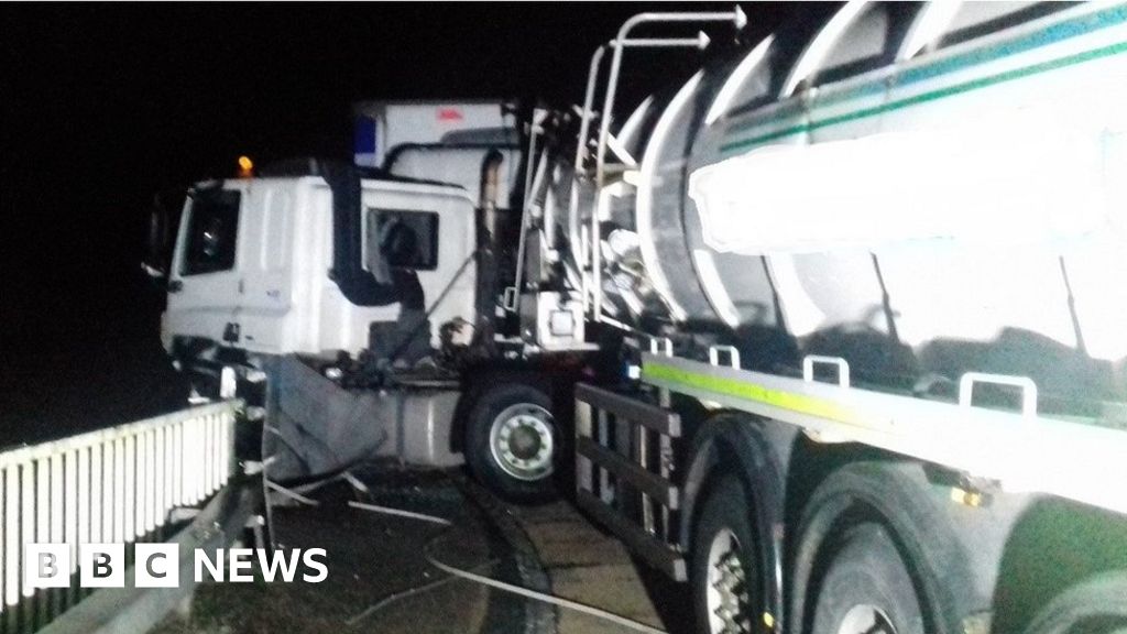 Trewen crash: Lorry left hanging off bridge - BBC News
