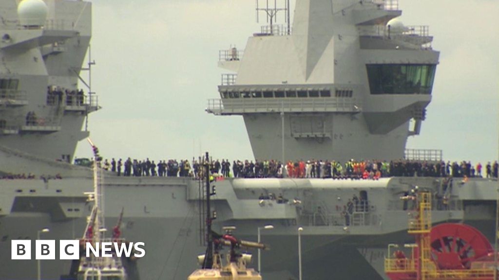 UK's largest warship embarks on maiden voyage - BBC News