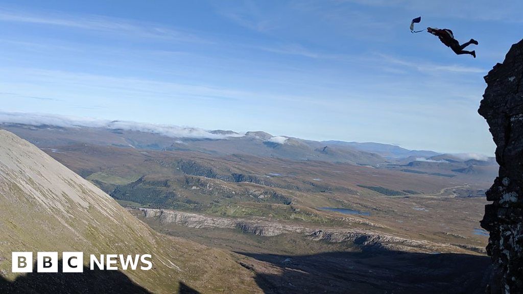 Base jumper 'lucky' to survive after hitting rock face - BBC News
