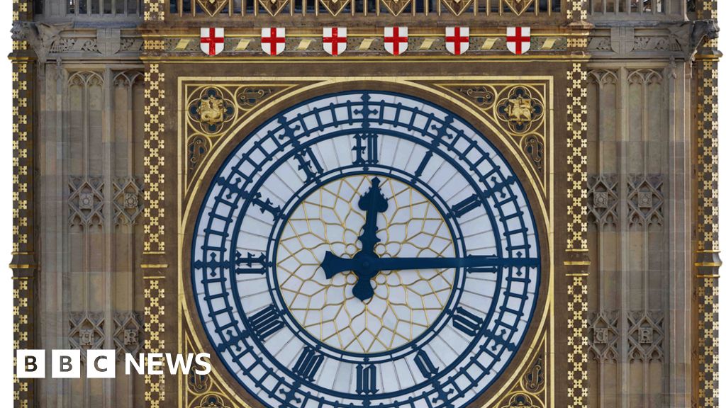 St George's Cross back on Big Ben after renovation - BBC News