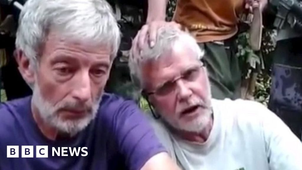 Philippines hostages: Video shows kidnapped tourists - BBC News