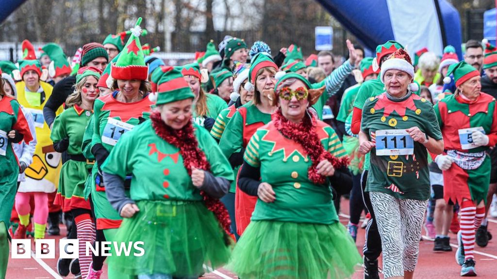 Hundreds of Santa's elves raise money for mental health charity - BBC News