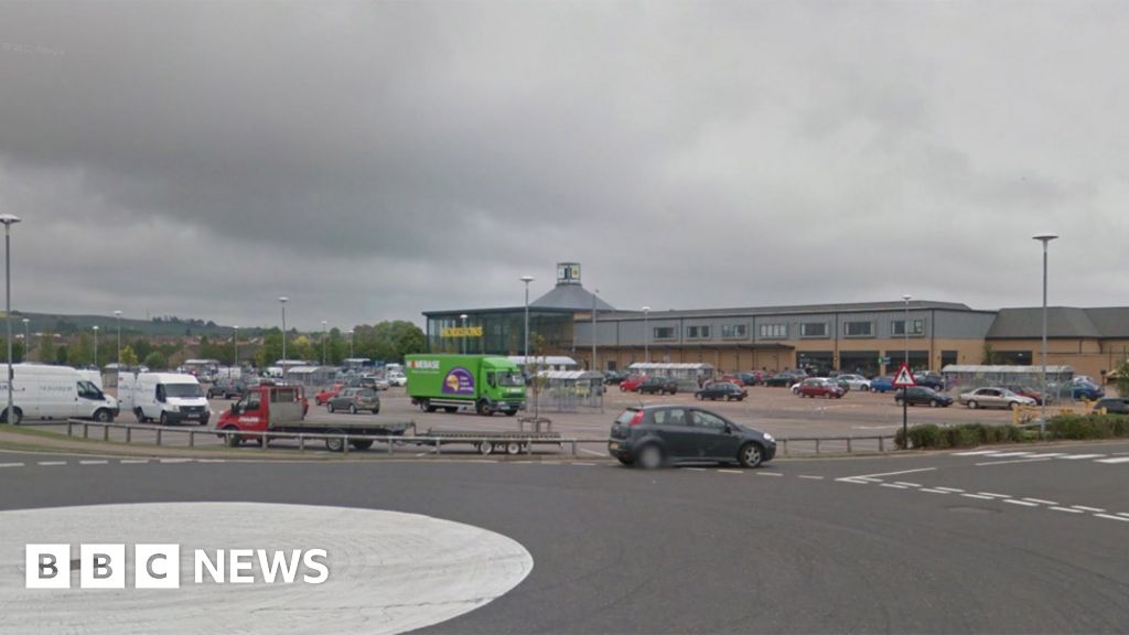 Mystery over man found injured outside Dundee supermarket - BBC News