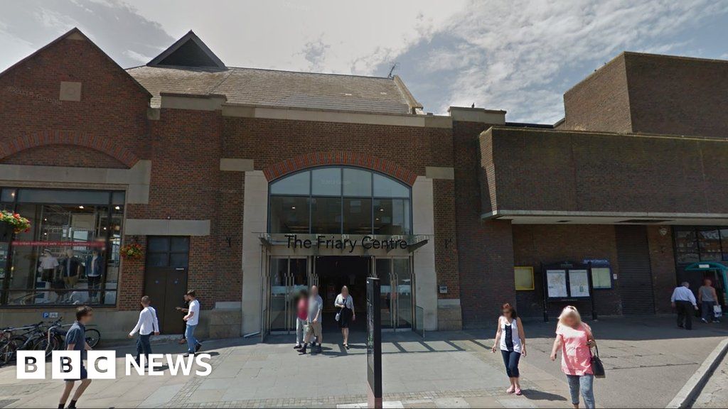Guildford's Friary centre evacuated after car fires - BBC News