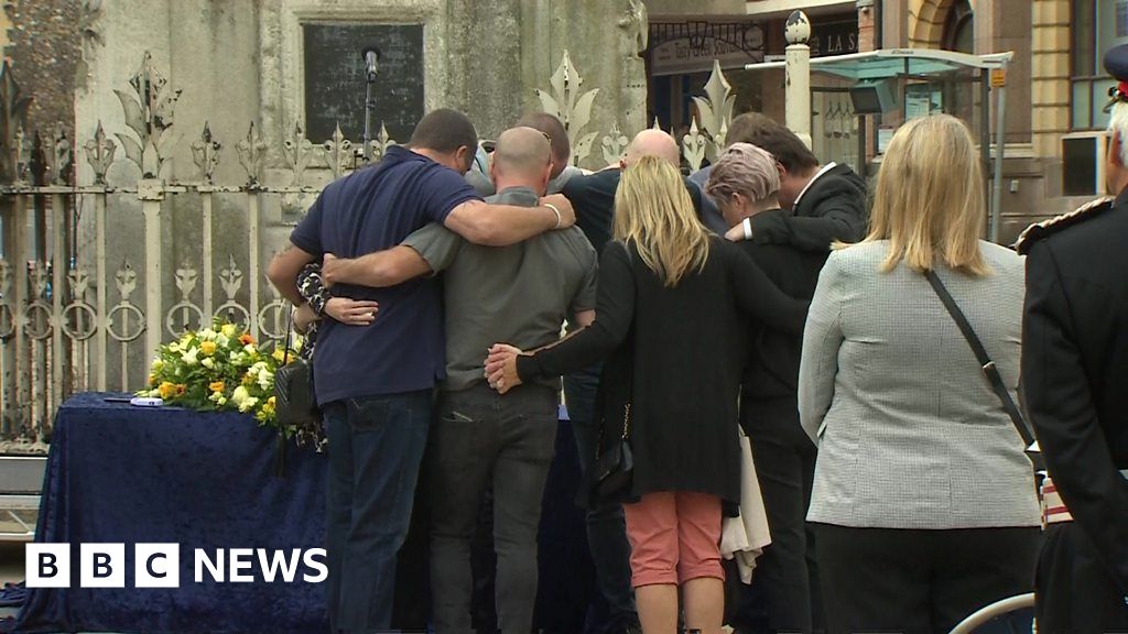 Reading stabbings: Family members light candles at vigil