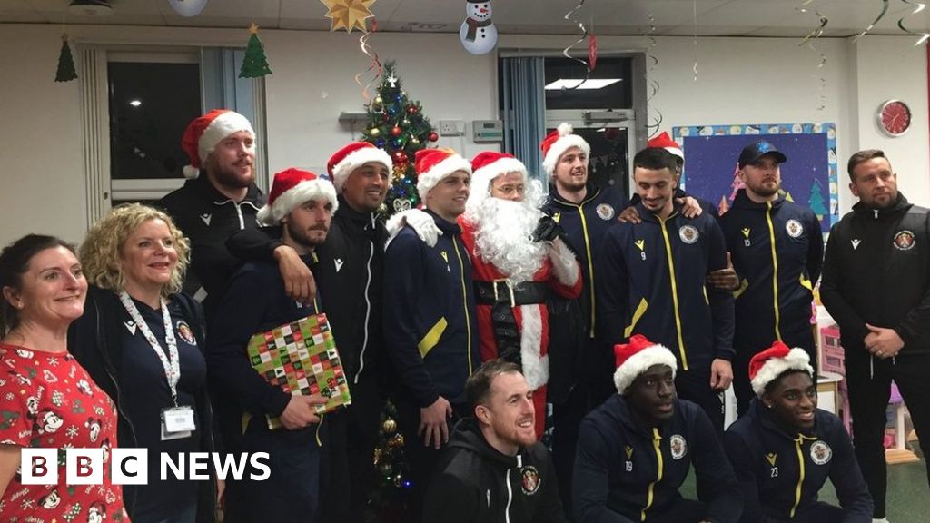 Slough Town brings Christmas joy to children at hospital ward