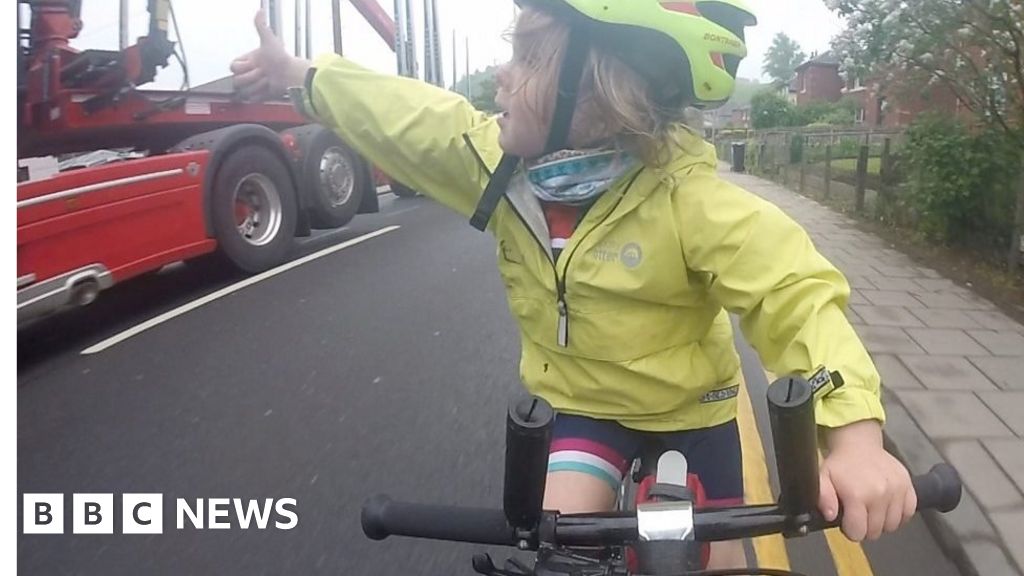 Cyclist, 4, gives lorry driver thumbs up for 'perfect pass' - BBC News
