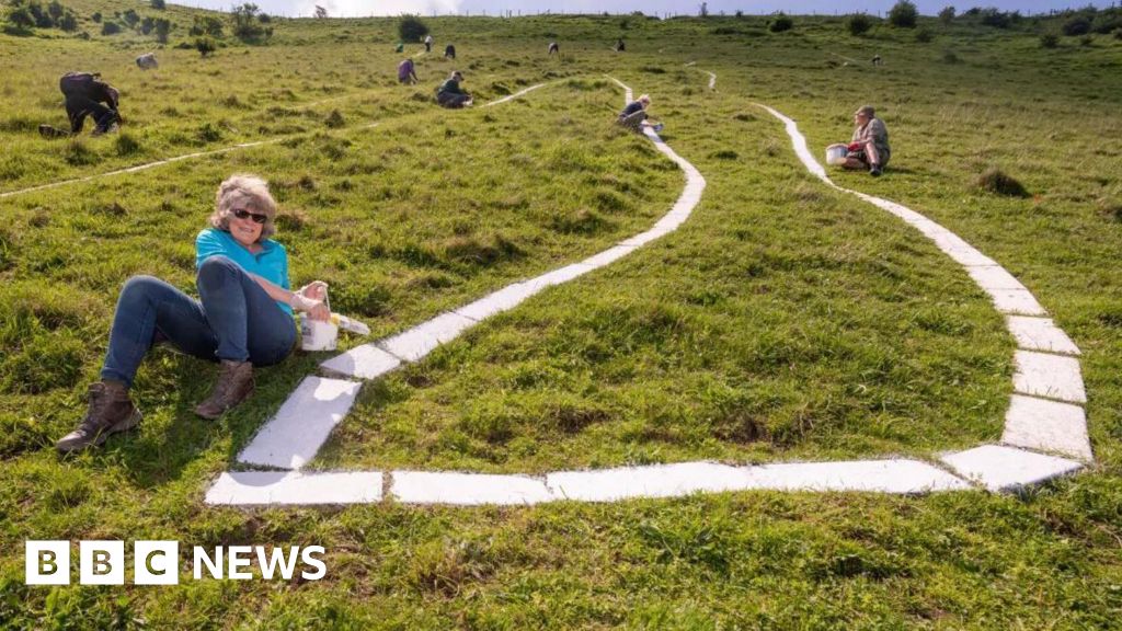 Long Man of Wilmington: Chalk carving repainted by volunteers