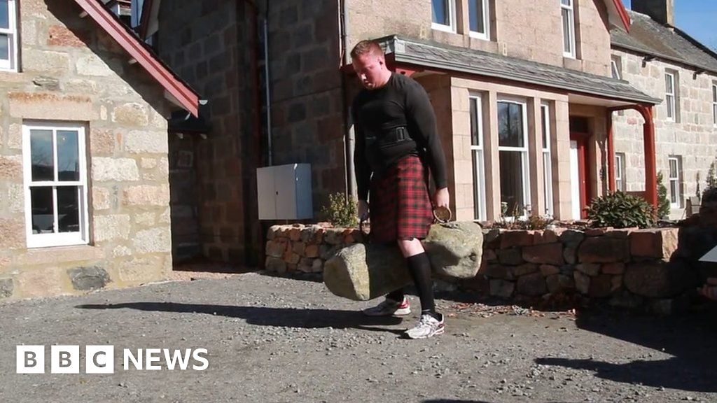 Tourist sets new record for lifting Dinnie Stones - BBC News