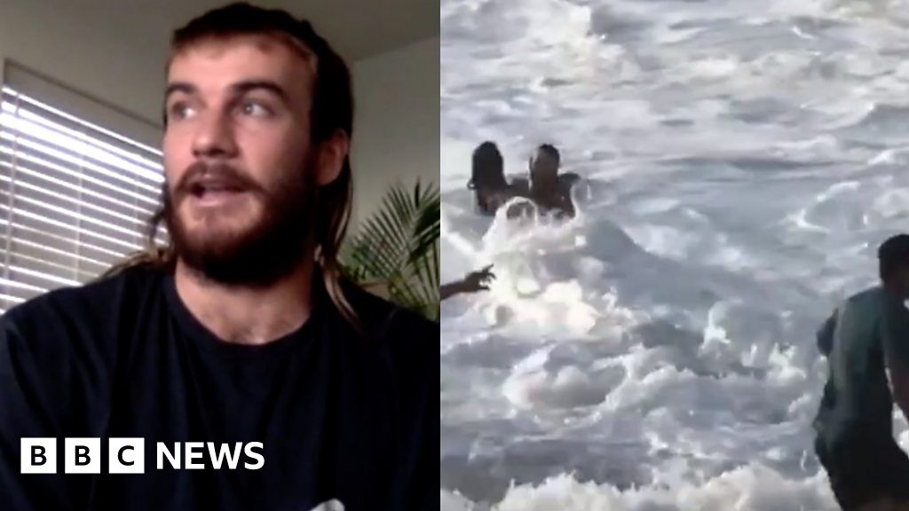 Australian surfer Mikey Wright rescues woman from Hawaii waves - BBC News