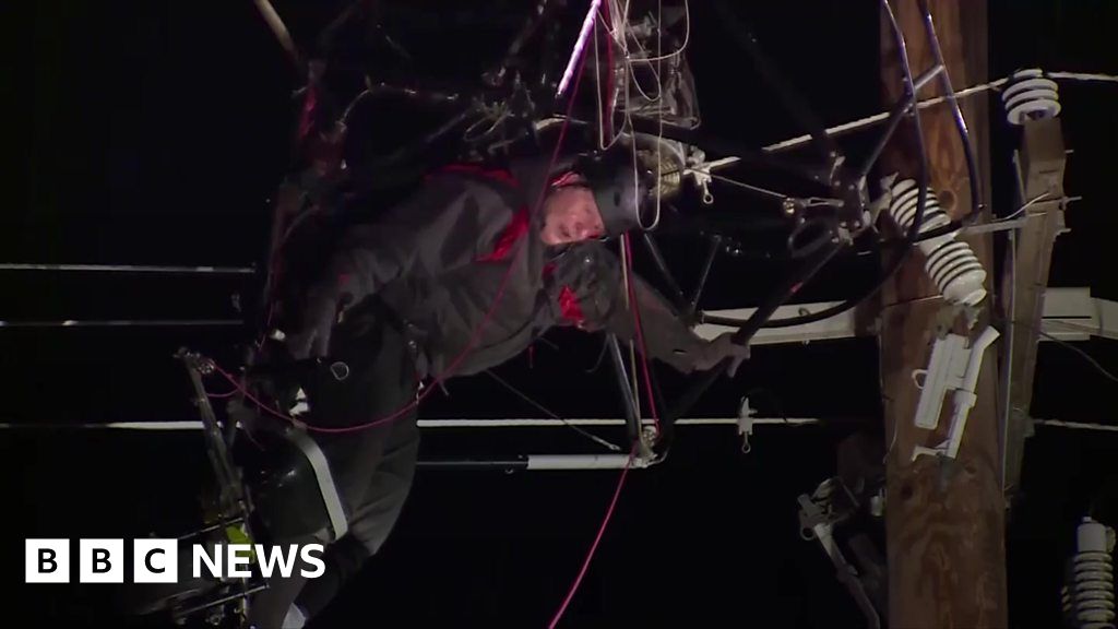 Paraglider hangs for hours after Californian power line mishap - BBC News