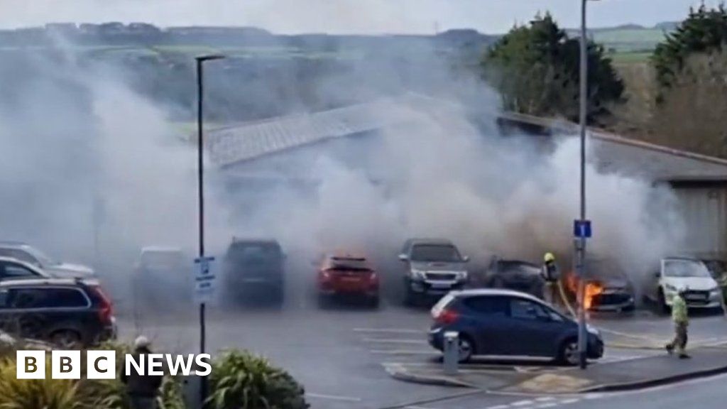 Cars on fire at Kingsley Village in Cornwall - BBC News