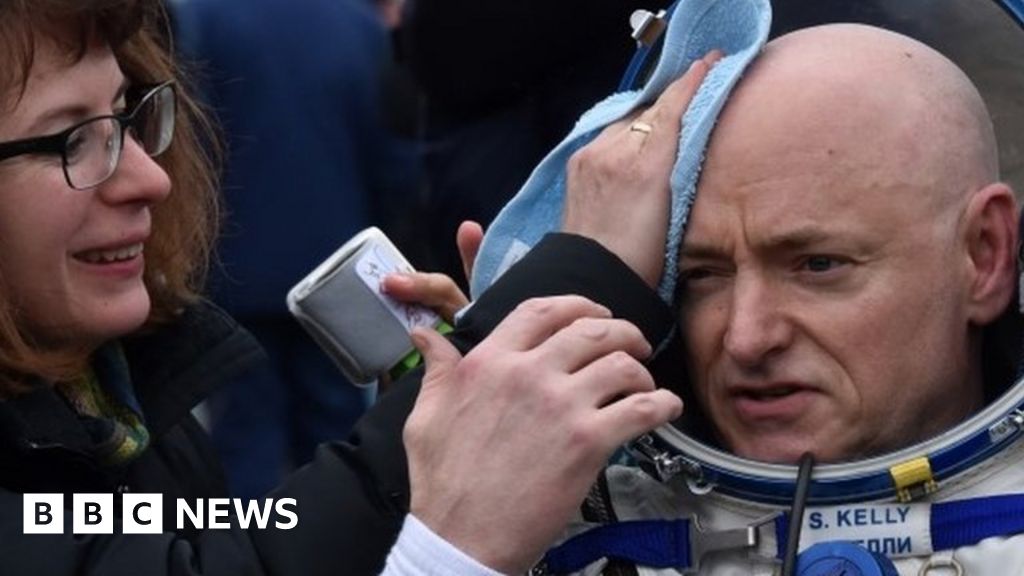 ISS astronauts return after spending nearly a year in space - BBC News