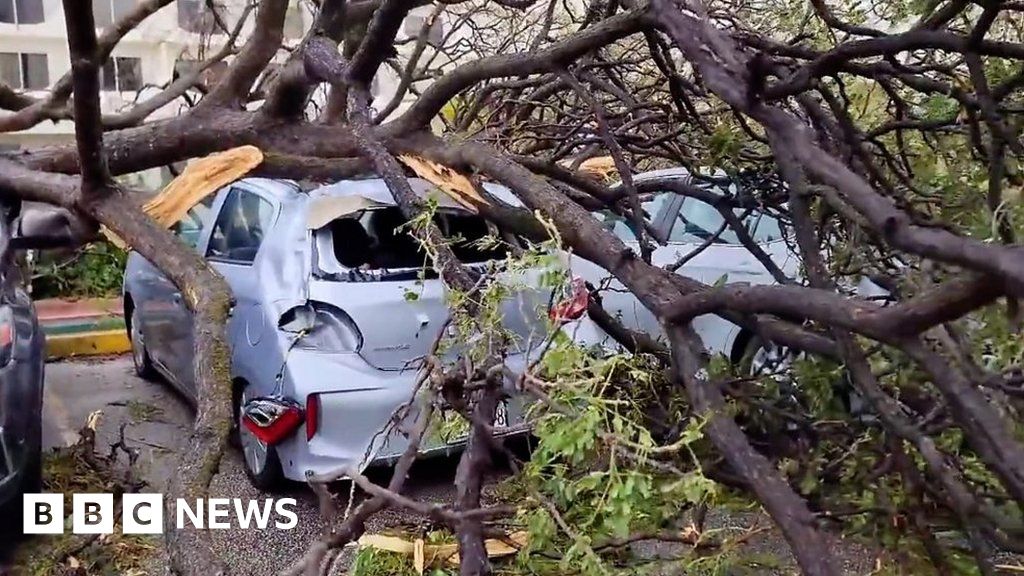 Gushing winds rip through Guam during typhoon - BBC News