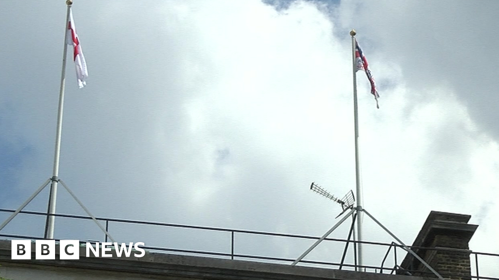 England flag raised above Wales Office - BBC News