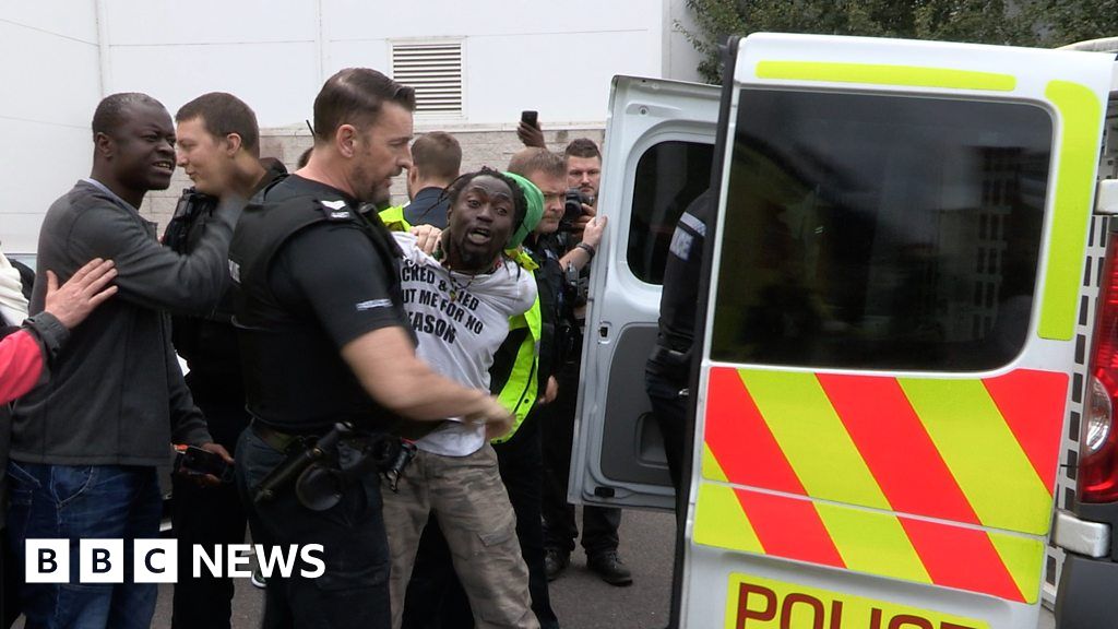 Security guard ends 21-hour Tesco ceiling protest - BBC News