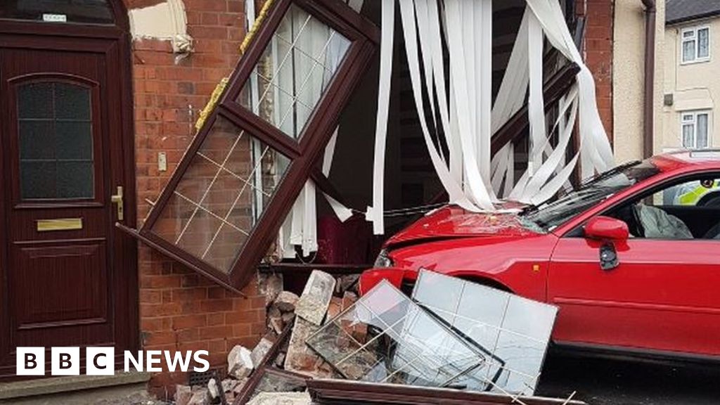 Driver missing after car hits house in Tipton - BBC News