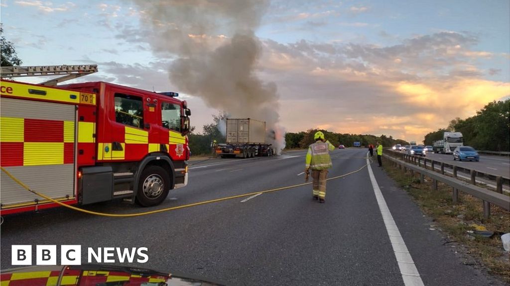 Lorry fire and oil spillage partly shuts M11 motorway in Essex