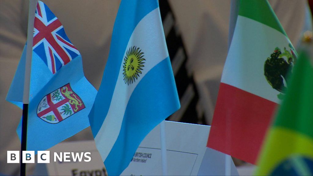 Students take part in mock COP28 event in Belfast - BBC News