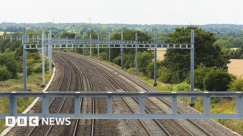 Goring Gap 'ugly scar' railway gantries removal call - BBC News