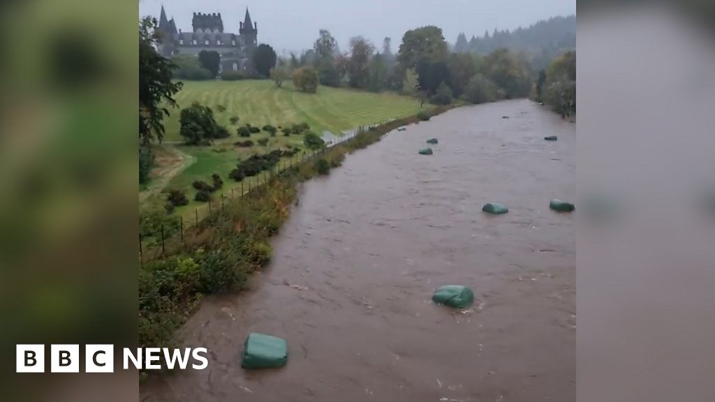 Bales of silage washed away by floods in Inveraray - BBC News