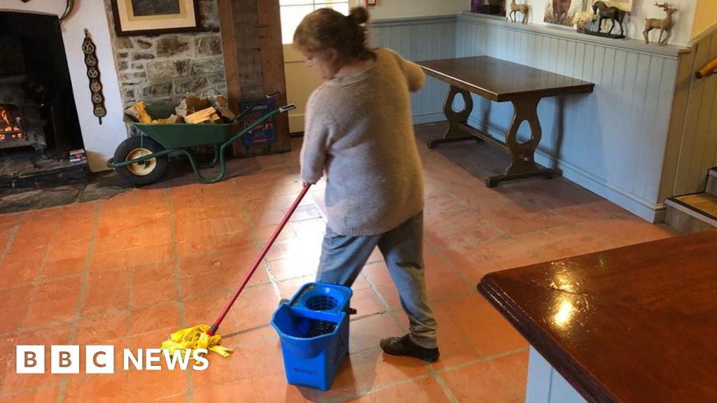 Villagers begin clean-up after flooding at Exebridge in Devon - BBC News