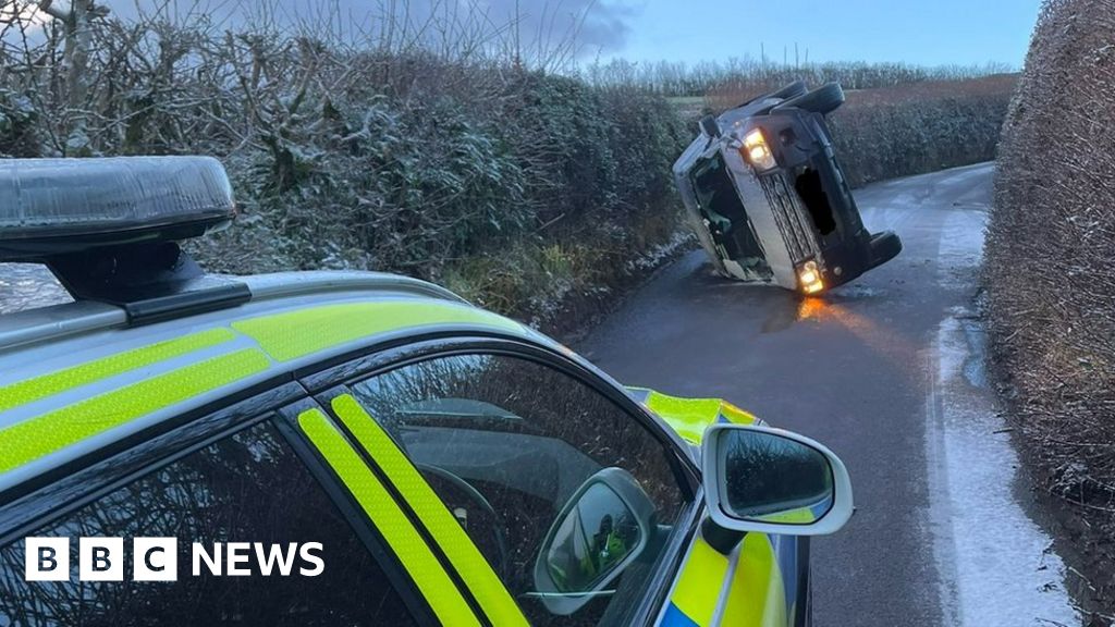 Wintery Devon roads lead to collisions and stuck cars - BBC News