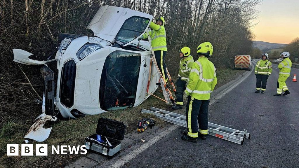 Man arrested after van flipped on its side - BBC News